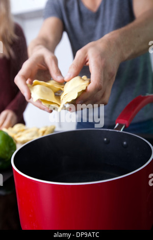 Midsection of woman cooking food Stock Photo - Alamy