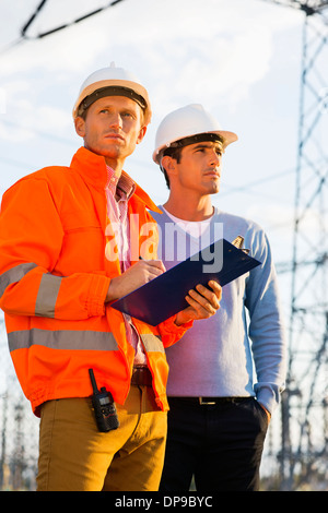 Male supervisor inspecting building Stock Photo - Alamy