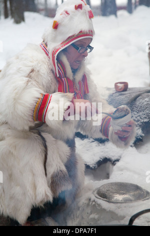 Outdoorlife Same Cooking on Campfire serving Souvas Smoked Reindeer ...