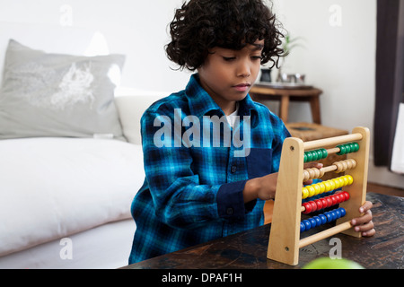 Boy Playing with Abacus Stock Photo - Alamy