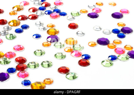 Close-up of multicolored rhinestones on white background Stock Photo ...