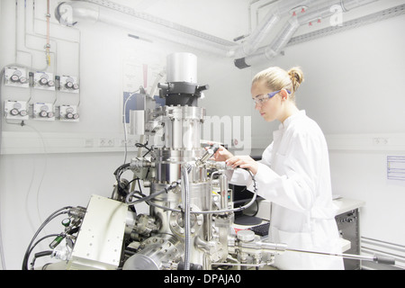 Technician working in optical laboratory Stock Photo - Alamy