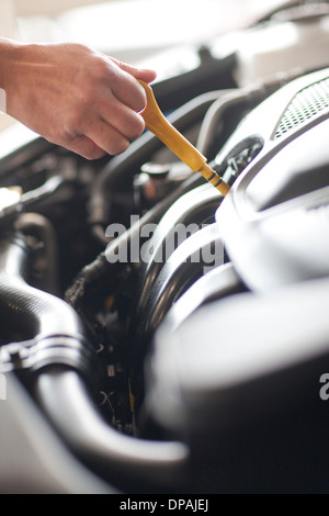 oil dipstick of car engine, check oil level Stock Photo - Alamy