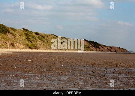 Mud flats and sandstone cliffs at Thurstaston on The Wirral Peninsular ...