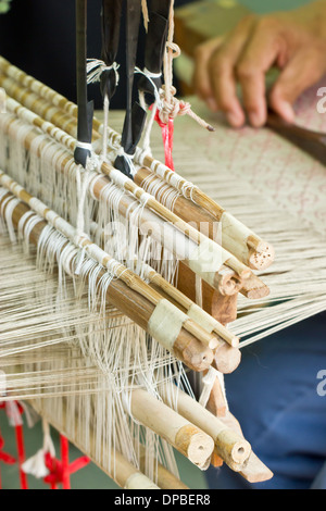 Traditional silk factory. Silk spinning machine at work. Dalat. Vietnam ...