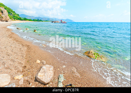 calm turquoise sea and rocky shore Stock Photo - Alamy