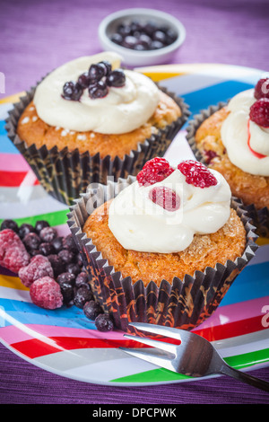 Tasty chocolate muffins on color background Stock Photo - Alamy
