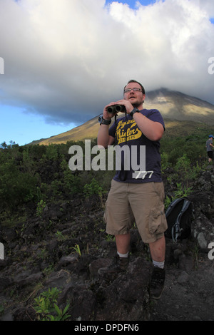 Tourist climbing Arenal Volcano Stock Photo - Alamy