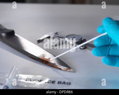 Forensic investigation of knife from crime scene Stock Photo - Alamy