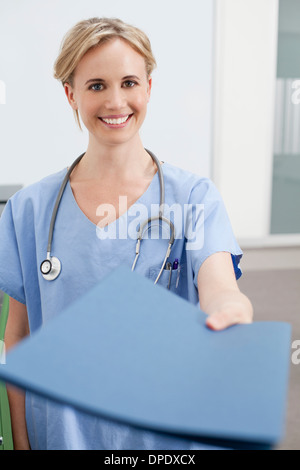 Handing over a document Stock Photo - Alamy