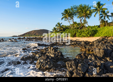 An unamed cove with a small strip of perfectly sandy beach Stock Photo ...