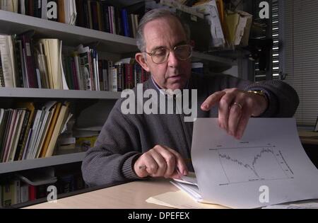 David Phillips, sociologist professor at UCSD, looks for charts in his ...