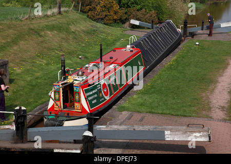 A traditional working narrowboat in Lock 8 of the Audlem flight of ...