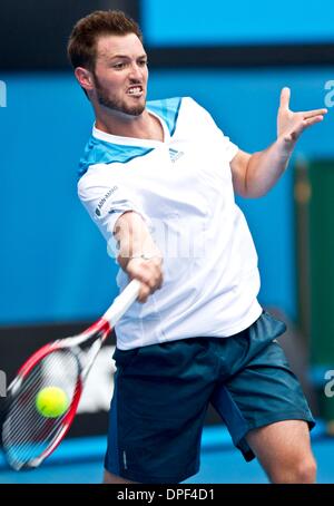 Rhyne Williams, of the United States, returns a shot to Nicolas Almagro ...