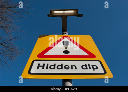 Hidden dip road sign Stock Photo - Alamy