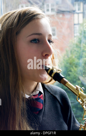 Beautiful student girl learning in a library Stock Photo - Alamy