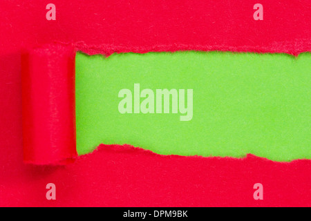 Red paper torn to reveal green panel ideal for copy space Stock Photo ...