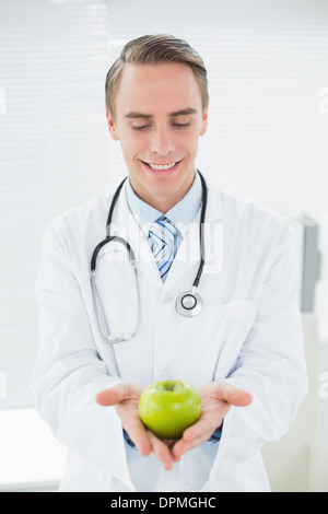 male doctor with green apple Stock Photo - Alamy
