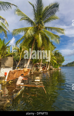 Kosrae, Micronesia (FSM). Local Kosrae man and his son at a traditional ...