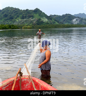 Fishing by net in shallow waters off the beach in Kosrae, Micronesia ...