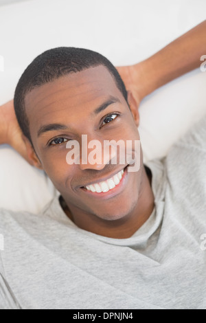 Young black man smiling while resting with his friends outdoors Stock ...