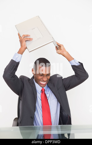 angry businessman smashing computer Stock Photo - Alamy