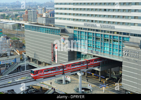 Elevated monorail train on rail. Guide wheels rubber tire on concrete guideway beam with ...