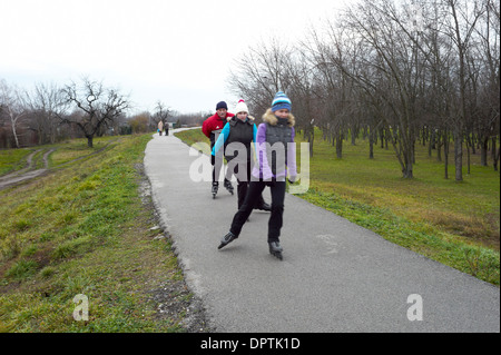 Children Roller Blading- In Line Skating Stock Photo - Alamy