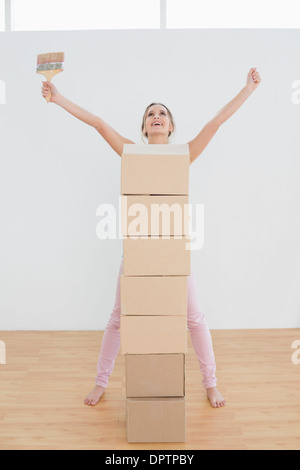 Happy and excited woman raising hands and shouting with joy celebrating ...