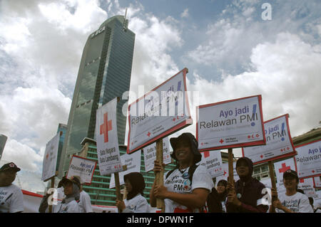 Dec 26, 2008 - Jakarta, Indonesia - Indonesian red cross members carry ...