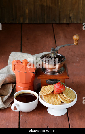 still life breakfast with waffles, strawberries and a cup of coffee ...