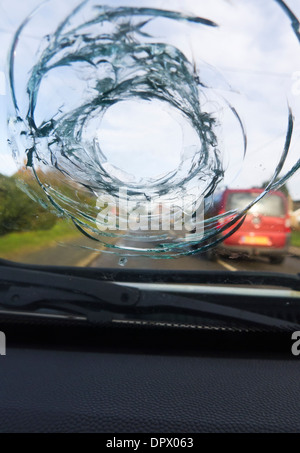 Vehicle windscreen damaged by a stone Stock Photo - Alamy