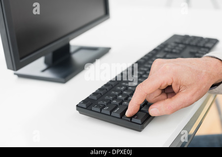 Hand man using keyboard computer laptop mock up blank white screen ...