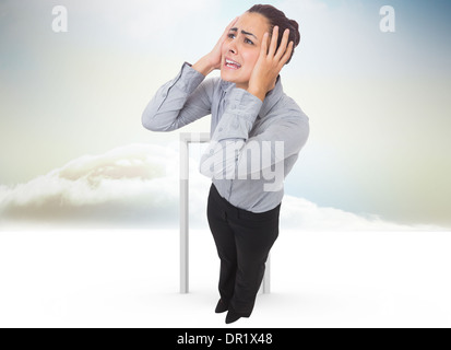 Composite image of desperate businesswoman Stock Photo - Alamy