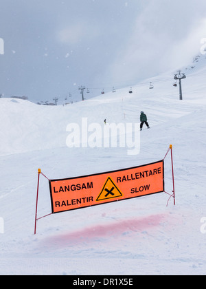 "Slow skiing" warning sign on ski slope in ski resort with majestic ...