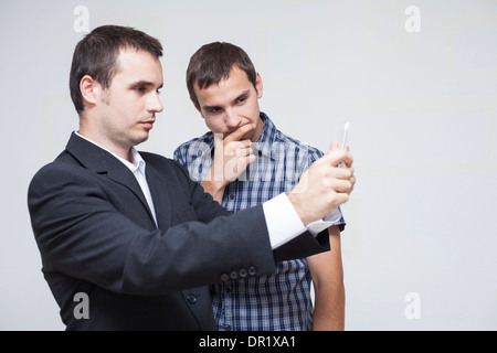 Two businessmen looking at tablet pc - business discussion concept ...