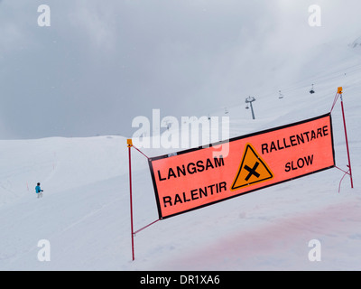 "Slow skiing" warning sign on ski slope in ski resort with majestic ...