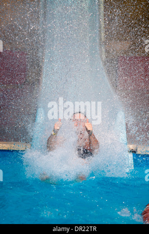 Man water sliding at aqua park Stock Photo - Alamy