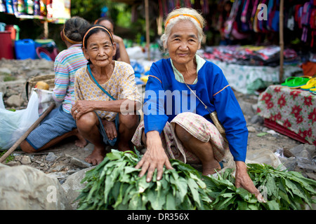 Hanunoo Mangyan women selling their crops at a Mangyan market near ...