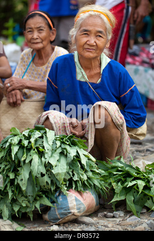Hanunoo Mangyan women selling their crops at a Mangyan market near ...