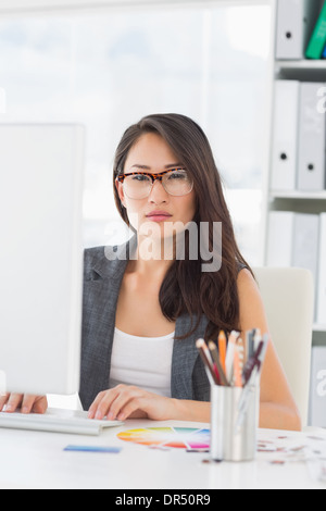 Young Asian woman using eye gel mask for skincare routine sitting on ...