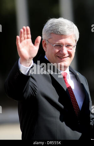 Prime Minister Stephen Harper waves during a stopover in Vancouver on ...