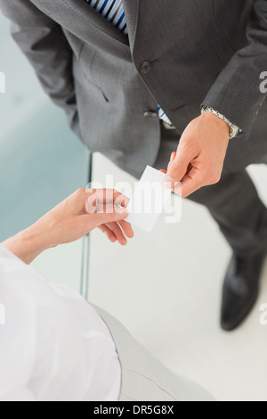 A businessman handing his business card Stock Photo - Alamy