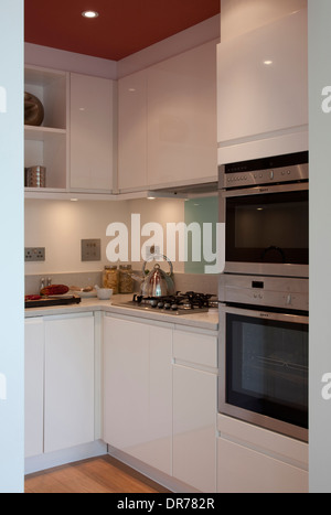 Hob and oven in fitted corner unit in modern kitchen Stock Photo - Alamy