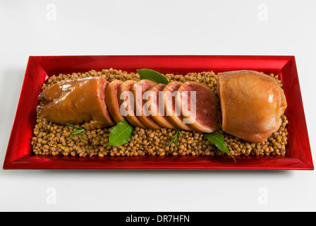 Zampone (boiled and stuffed pig's trotter) on lentils, Italian cooking ...