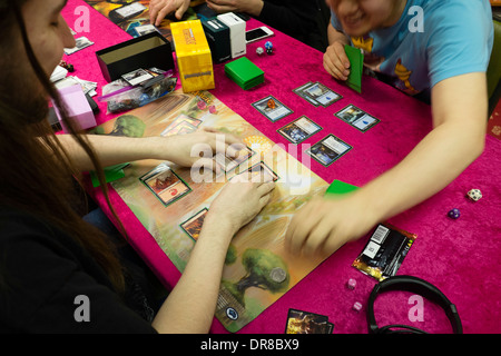 A group of people playing Magic: The Gathering role-playing collectible ...