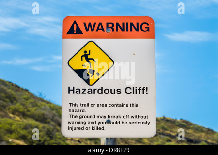 Hiking trail warning sign with dangers Stock Photo - Alamy
