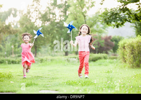 kids playing with a toy wind mills Stock Photo - Alamy
