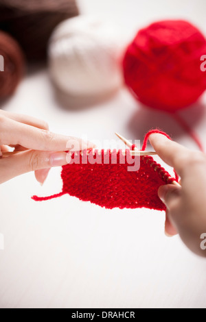 Above view of woman doing knit work leisure activity at home indoor ...