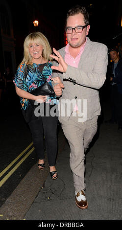 Alan Carr wearing Spatz shoes walks with former Coronation street star ...